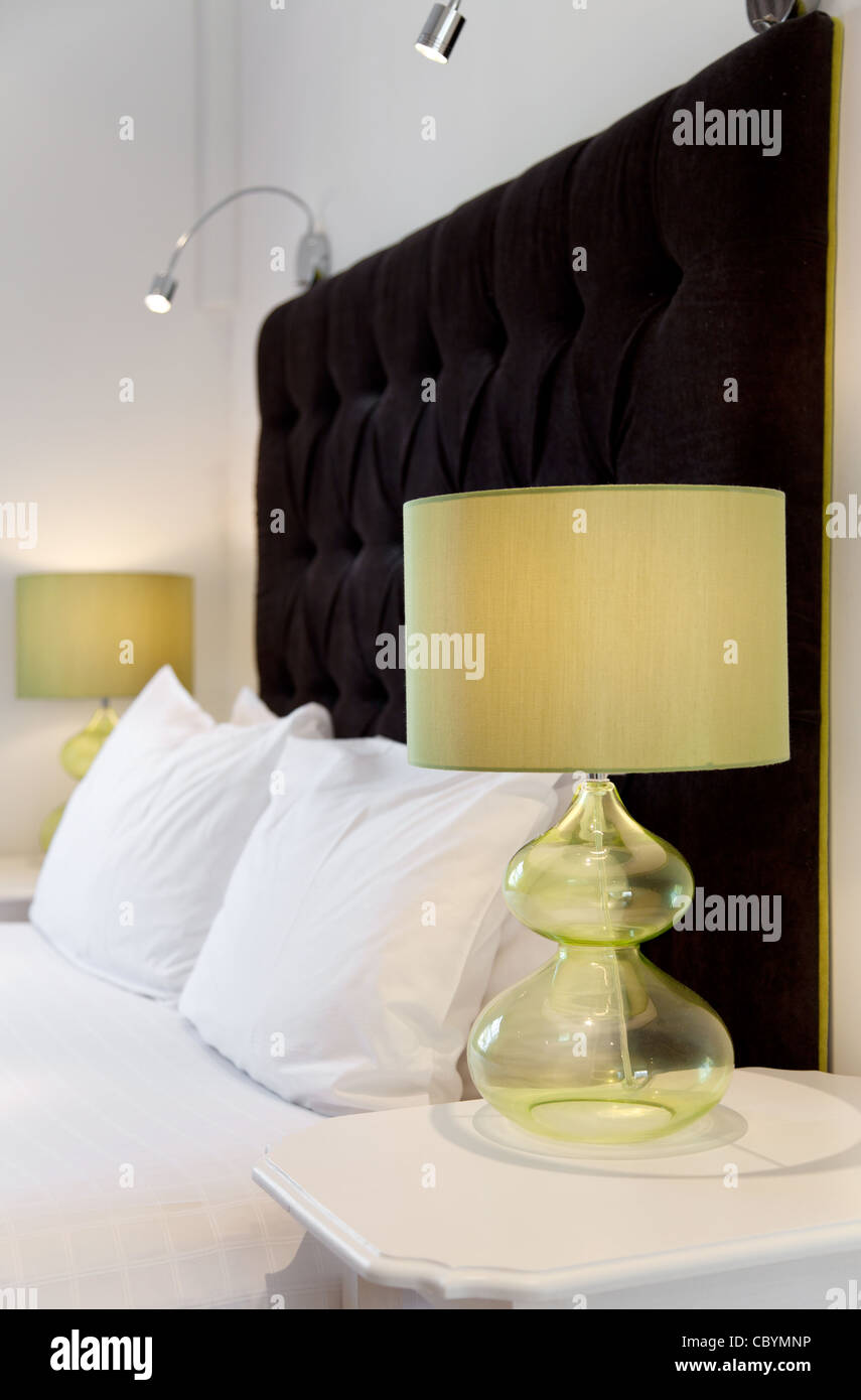 Luxurious modern bed design and bedside lamps Stock Photo - Alamy