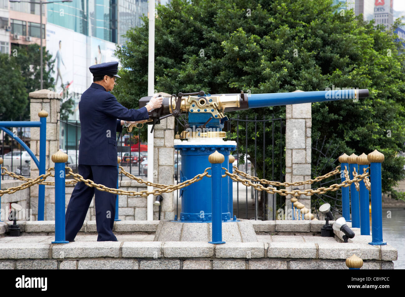 chinese man preparing to fire jardines noonday gun in causeway bay hong ...
