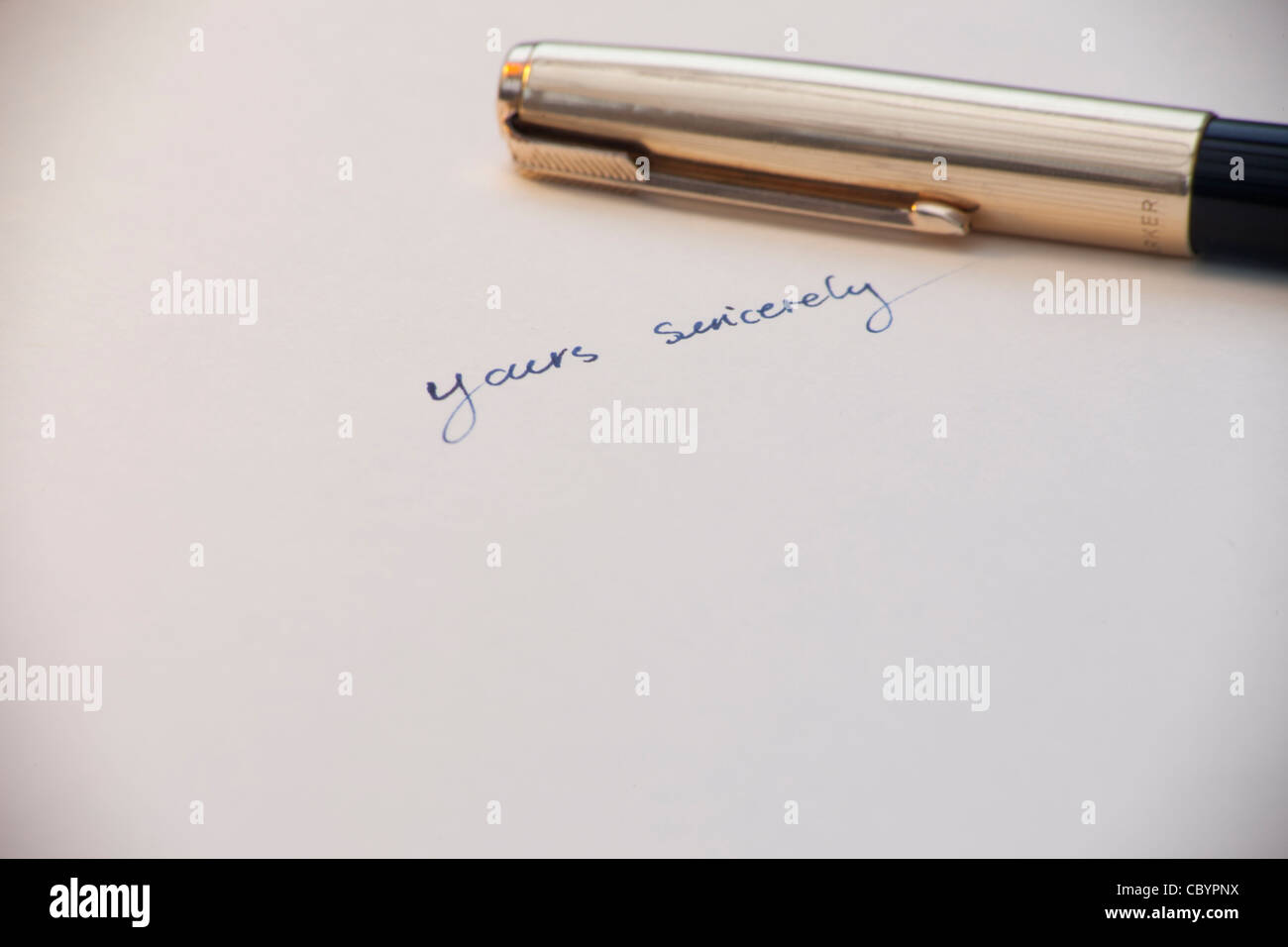 The words "yours sincerely" handwritten in ink with fountain pen in ...