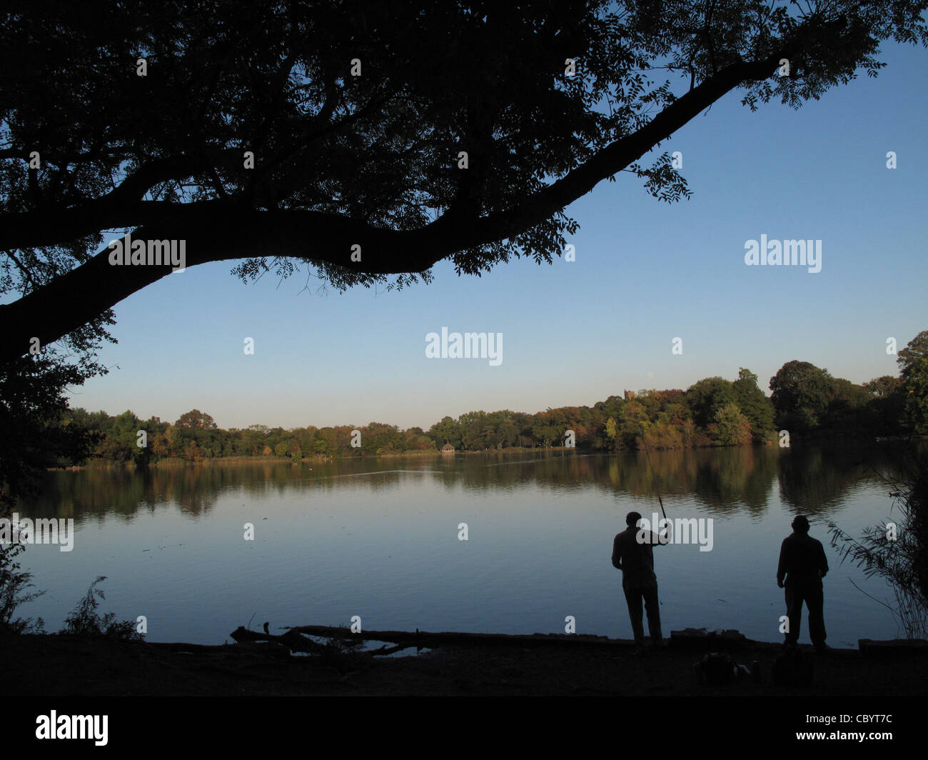 People fish in a lake in Prospect Park, Brooklyn, New York, November 9 ...