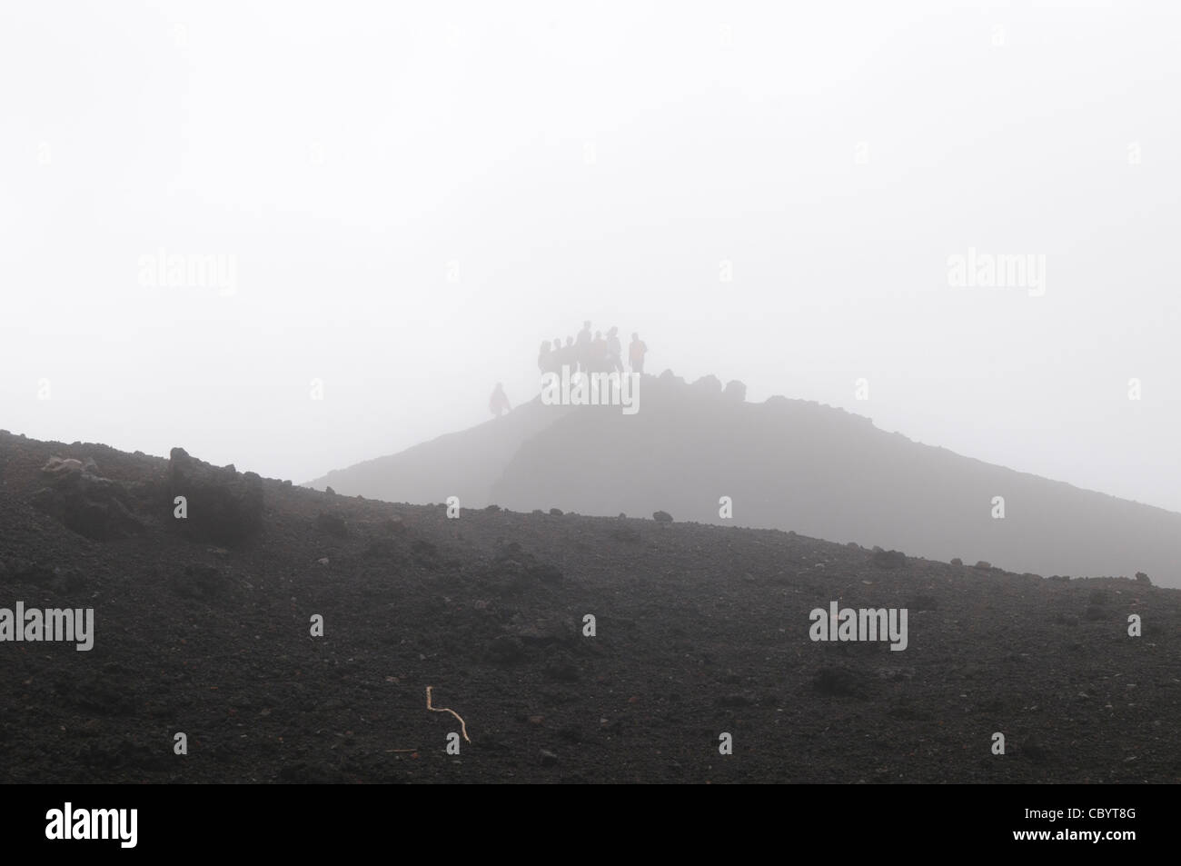 PACAYA VOLCANO, Guatemala — A group of tourists stands on top of one of ...