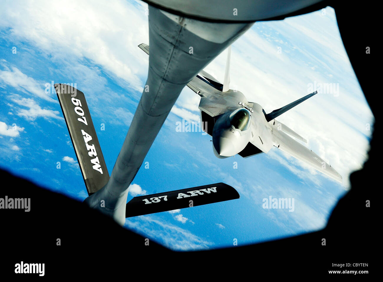 An F-22 Raptor aircraft prepares to receive fuel from a KC-135 ...
