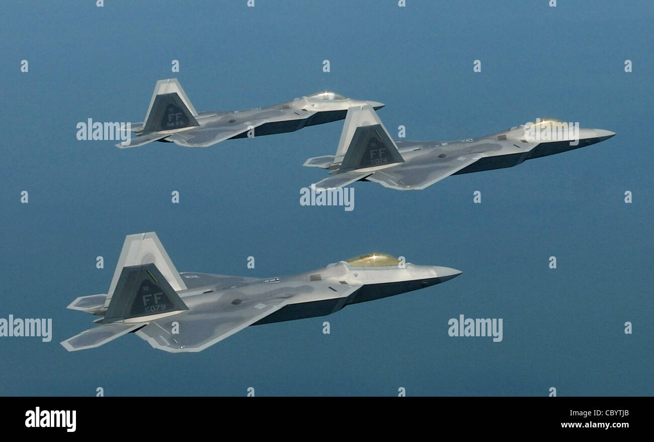 F-22 Raptors fly in formation. Air turbines used in the F-22s are now ...