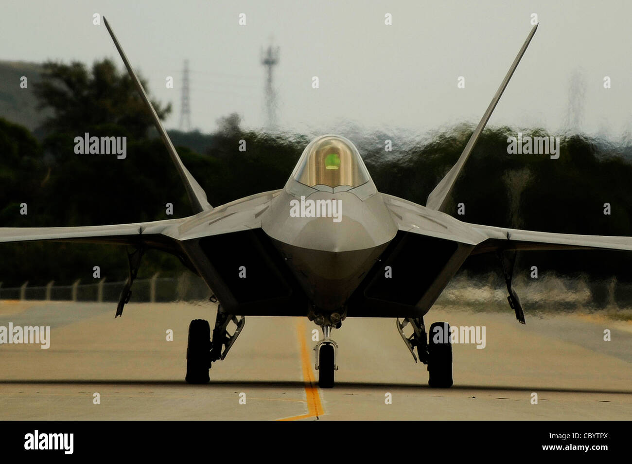 An F-22 Raptor taxies down the ramp for a mission Jan. 14 at Kadena Air ...