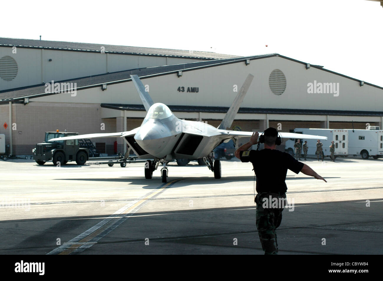Tech. Sgt. Lewis Hale, marshals an F-22A Raptor, the new ground ...