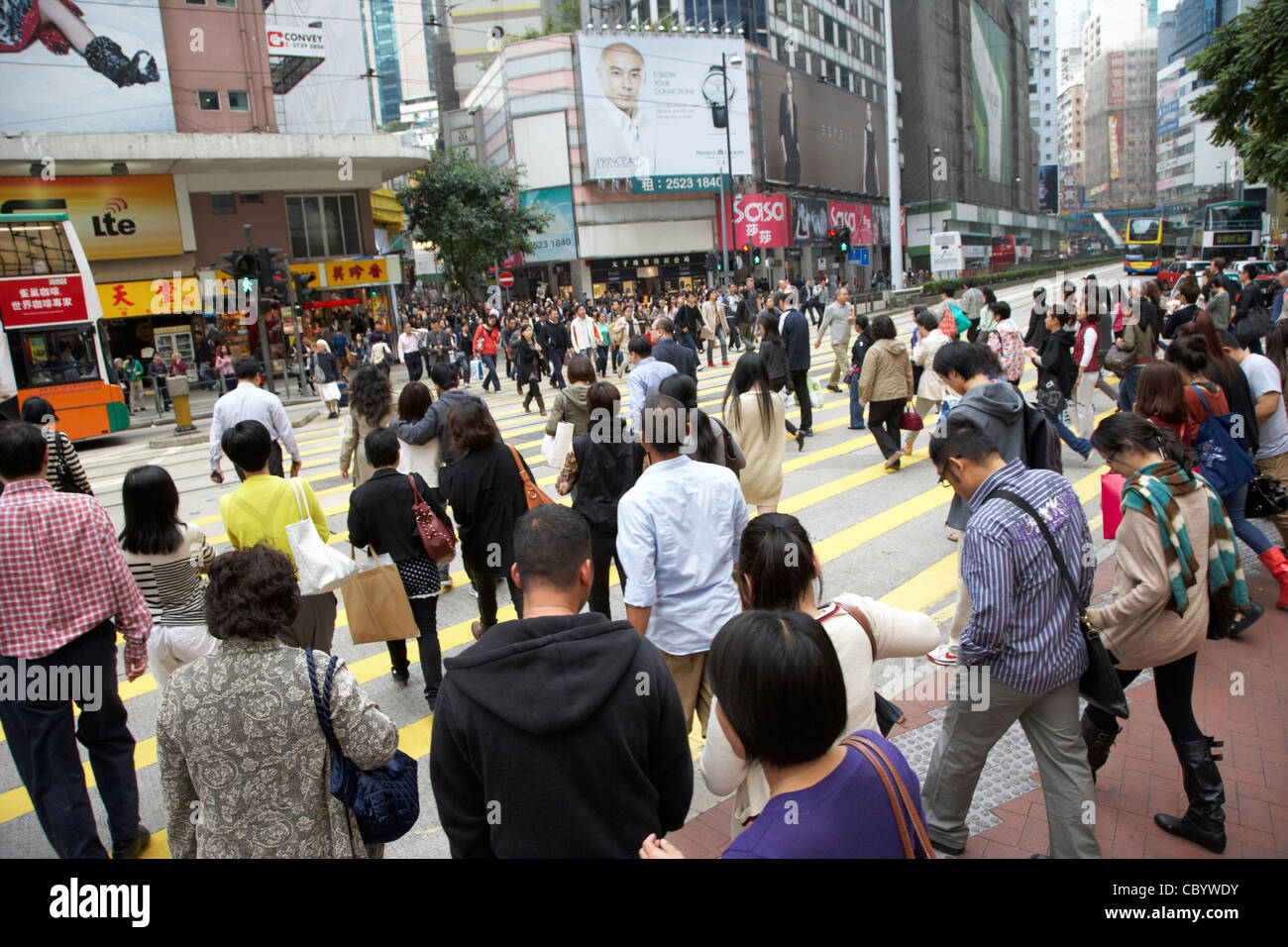 crowd of chinese shoppers on pedestrian crossing yee wo street causeway ...