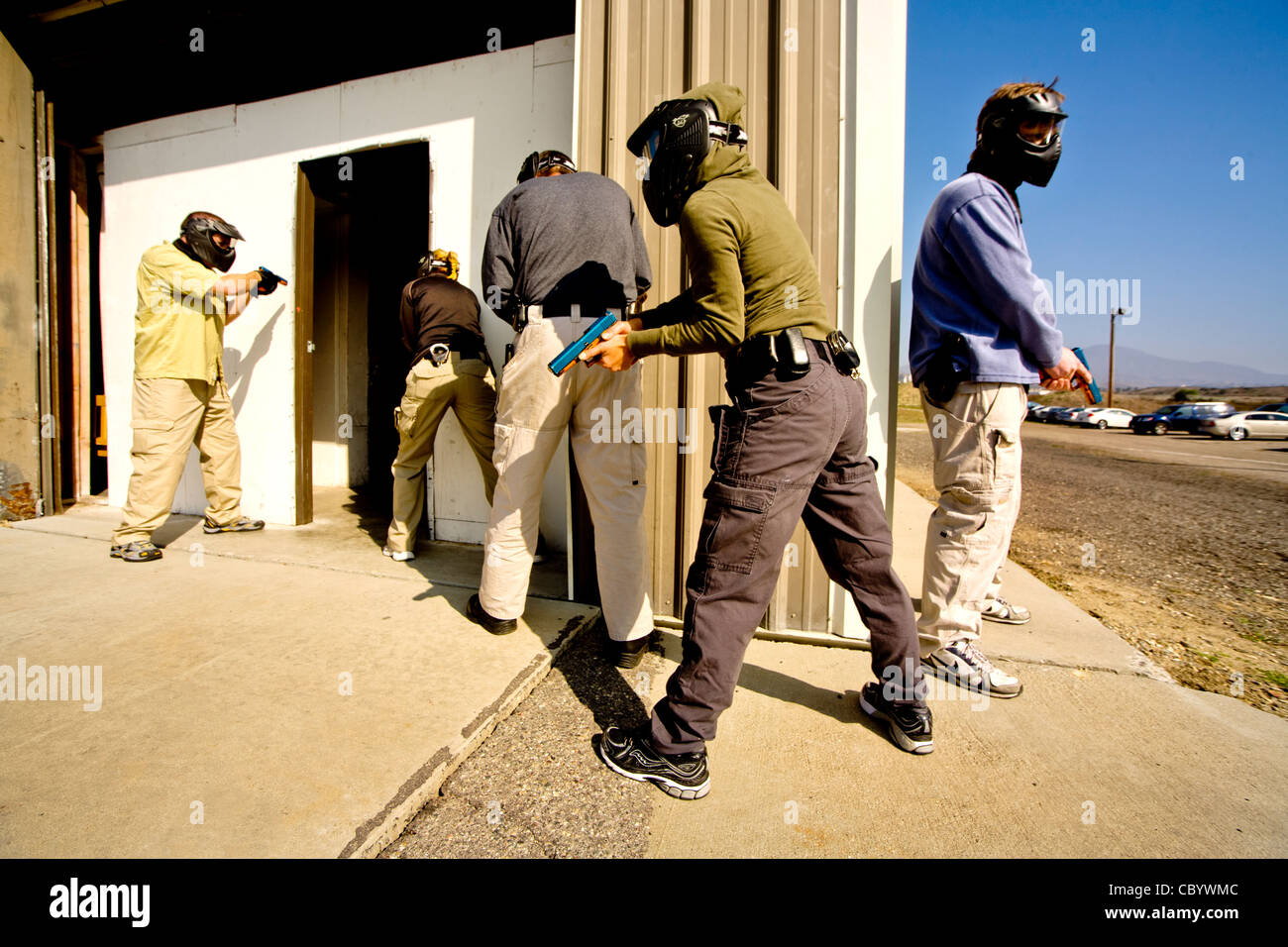 Working as a team, male and female female law enforcement agents ...