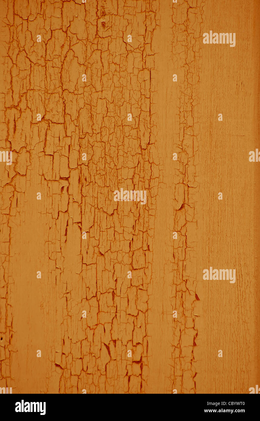 Yellow flaky paint on a wood background Stock Photo - Alamy