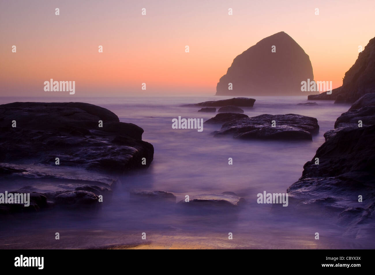Oregon Beach Sunset with Waves in Motion Stock Photo - Alamy