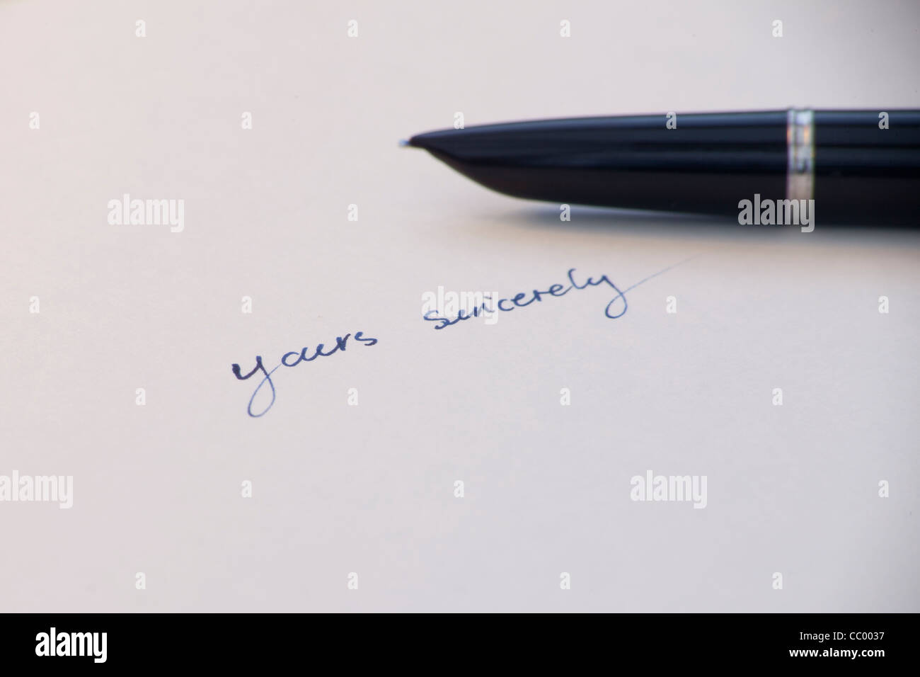 The words "yours sincerely" handwritten in ink with fountain pen in ...