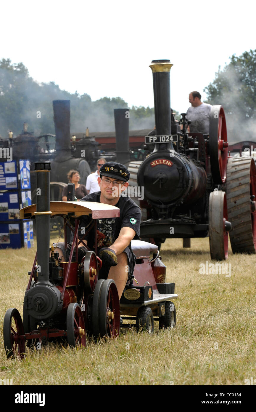 A Steam engine enthusiast operates his miniature steam engine at the ...
