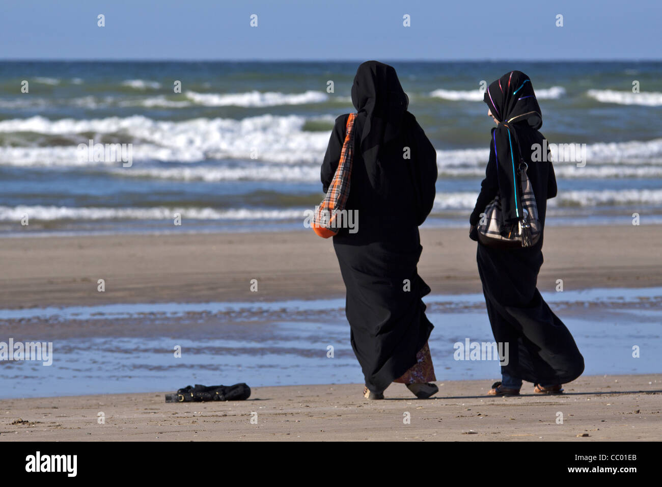 VEILED OMANI WOMEN ENJOYING THE BEACH IN MUSCAT, GULF OF OMAN ...