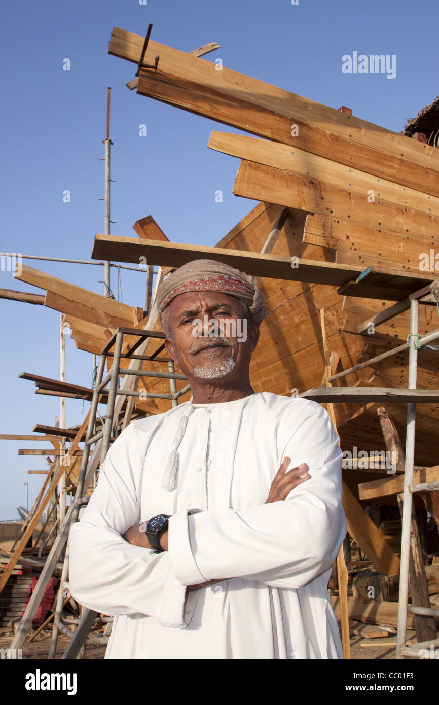 PORTRAIT OF THE OWNER OF A TRADITIONAL DHOW MAKING SHOP, SUR, SULTANATE ...