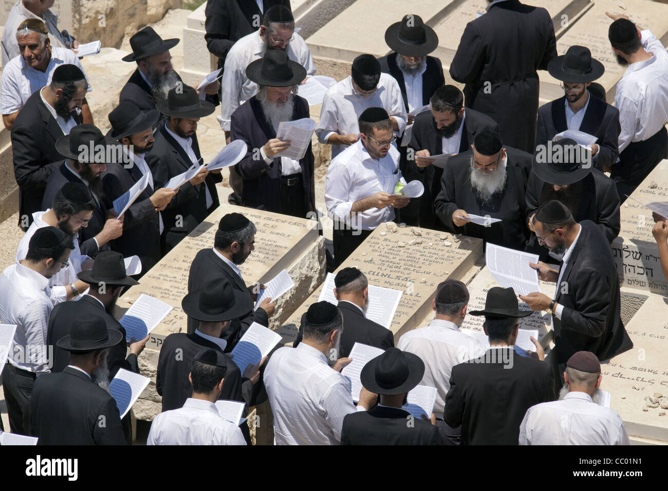 JEWISH MEN CONDUCTING A FUNERAL IN THE JEWISH CEMETERY, JERUSALEM ...