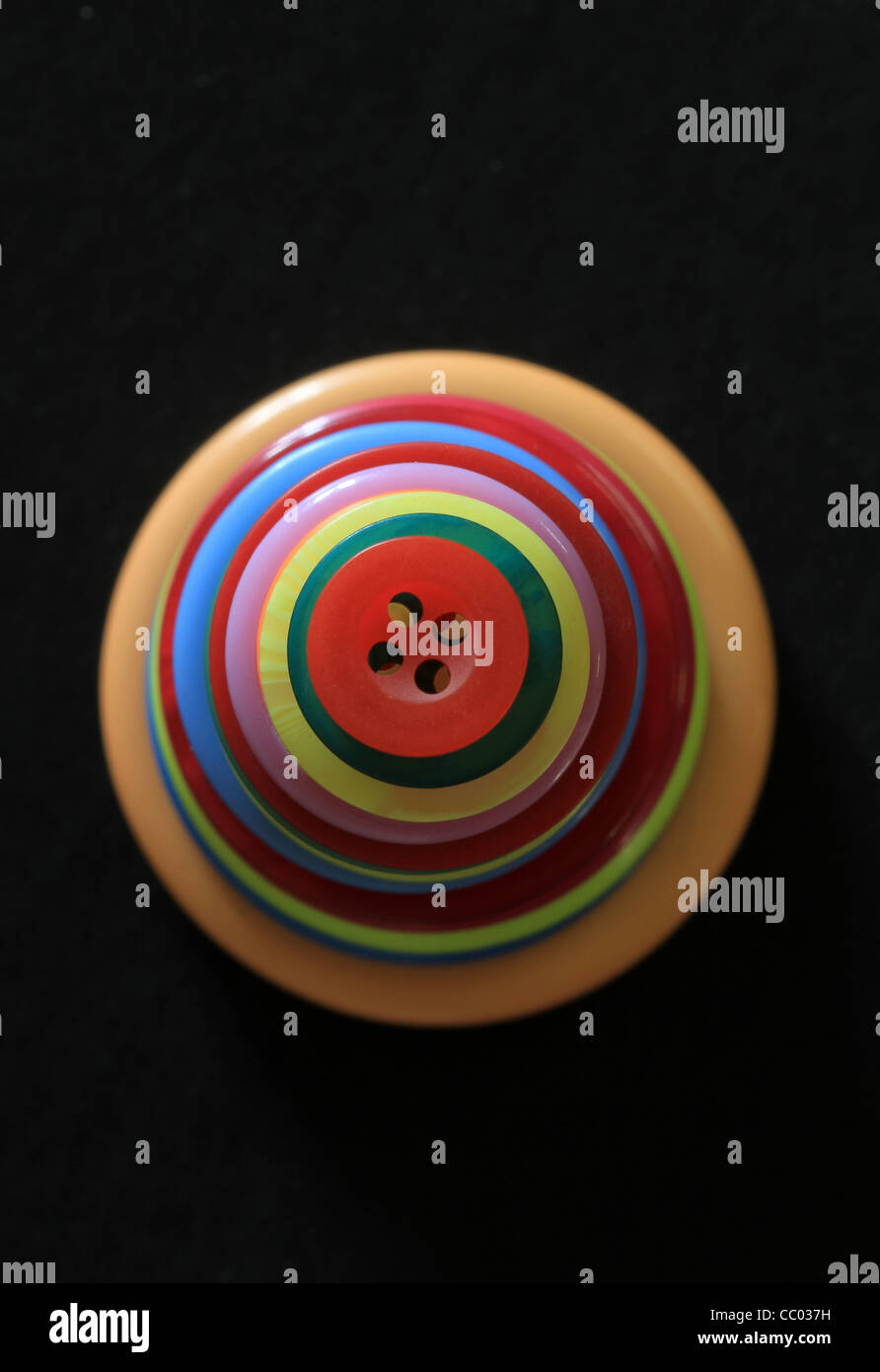 Colourful buttons stacked on top of each other Stock Photo - Alamy