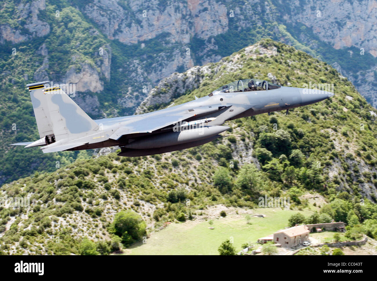 F-15 flying over a mountain landscape Stock Photo - Alamy