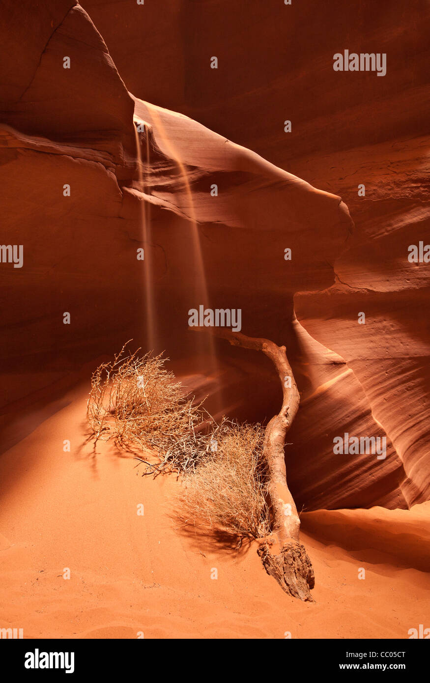 Sand trickles over a Navajo Sandstone ledge in Upper Antelope Canyon ...