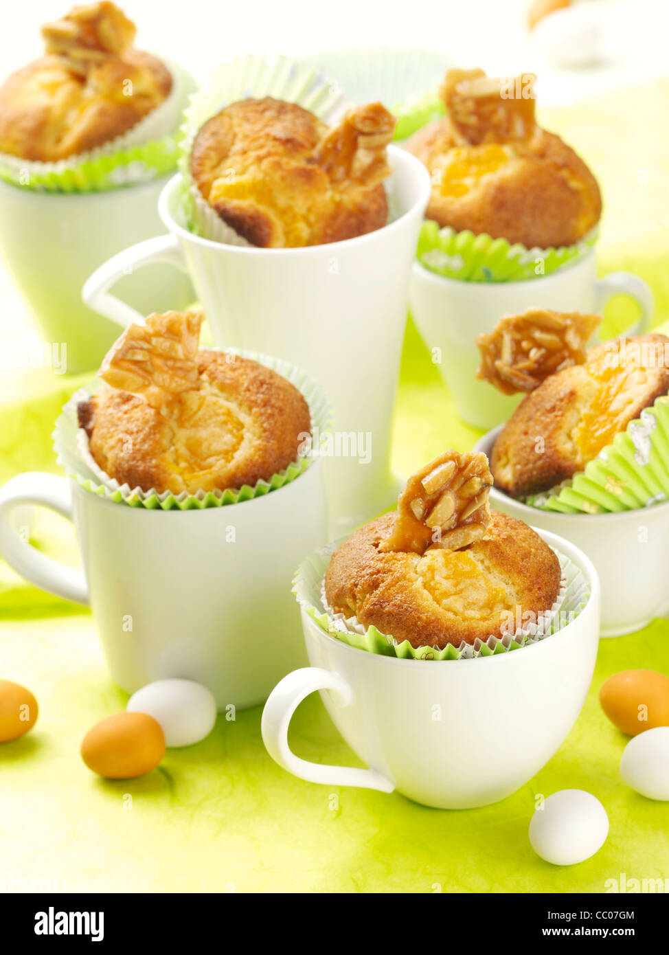 Mandarin muffins with egg liqueur and almond brittle Stock Photo - Alamy