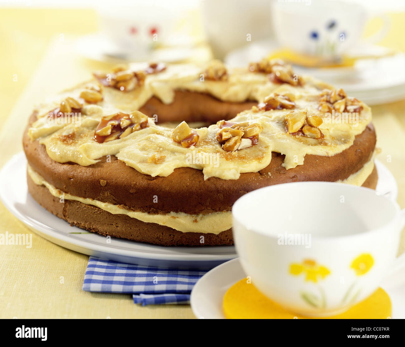 Almond croquant ring cake filled with vanilla cream Stock Photo - Alamy