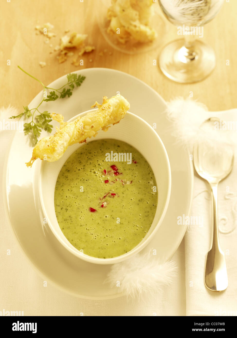 Chervil cream soup with parmesan sesame stick Stock Photo - Alamy