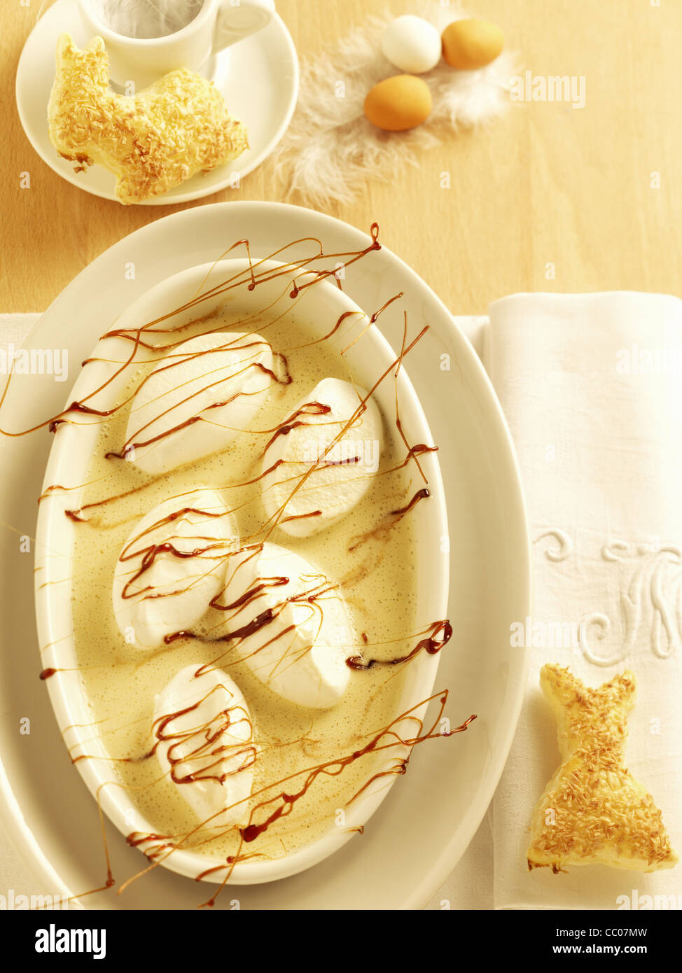 Snow eggs with caramel Stock Photo - Alamy