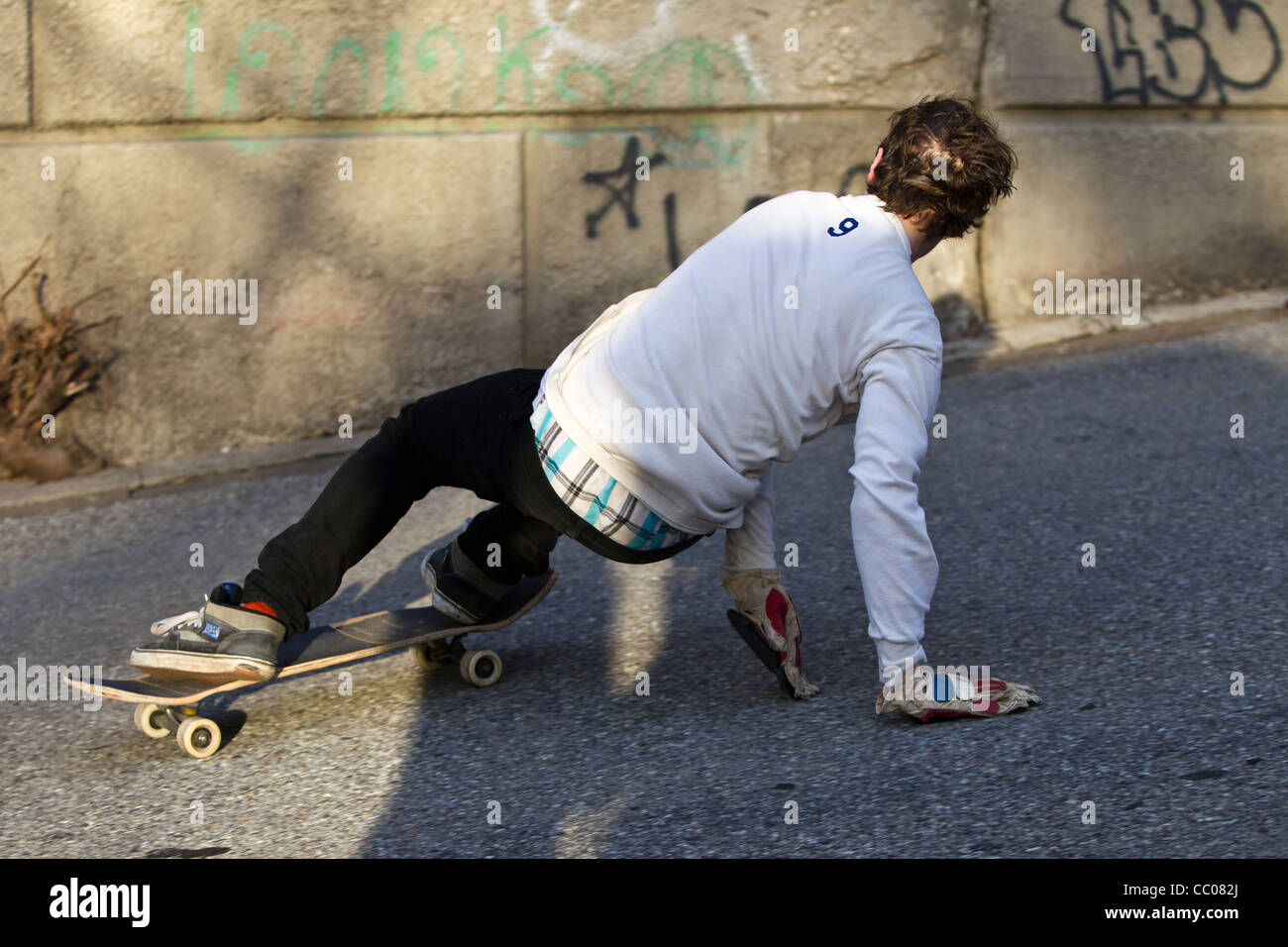 Young male skateboarder on urban street Stock Photo - Alamy
