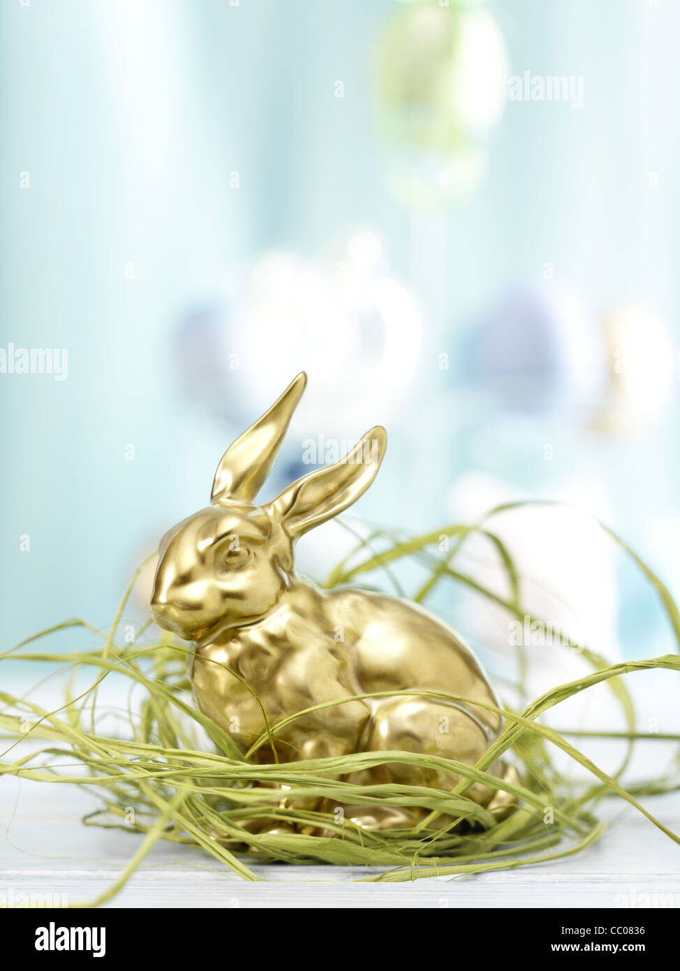 Golden Easter bunny on deco grass Stock Photo - Alamy