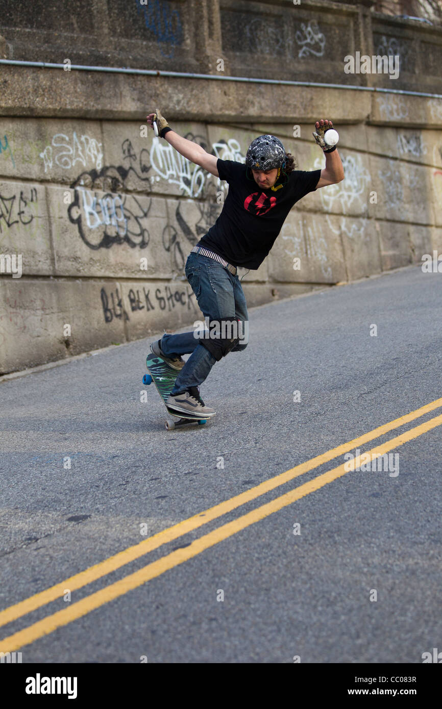 Young male skateboarder on urban street Stock Photo - Alamy