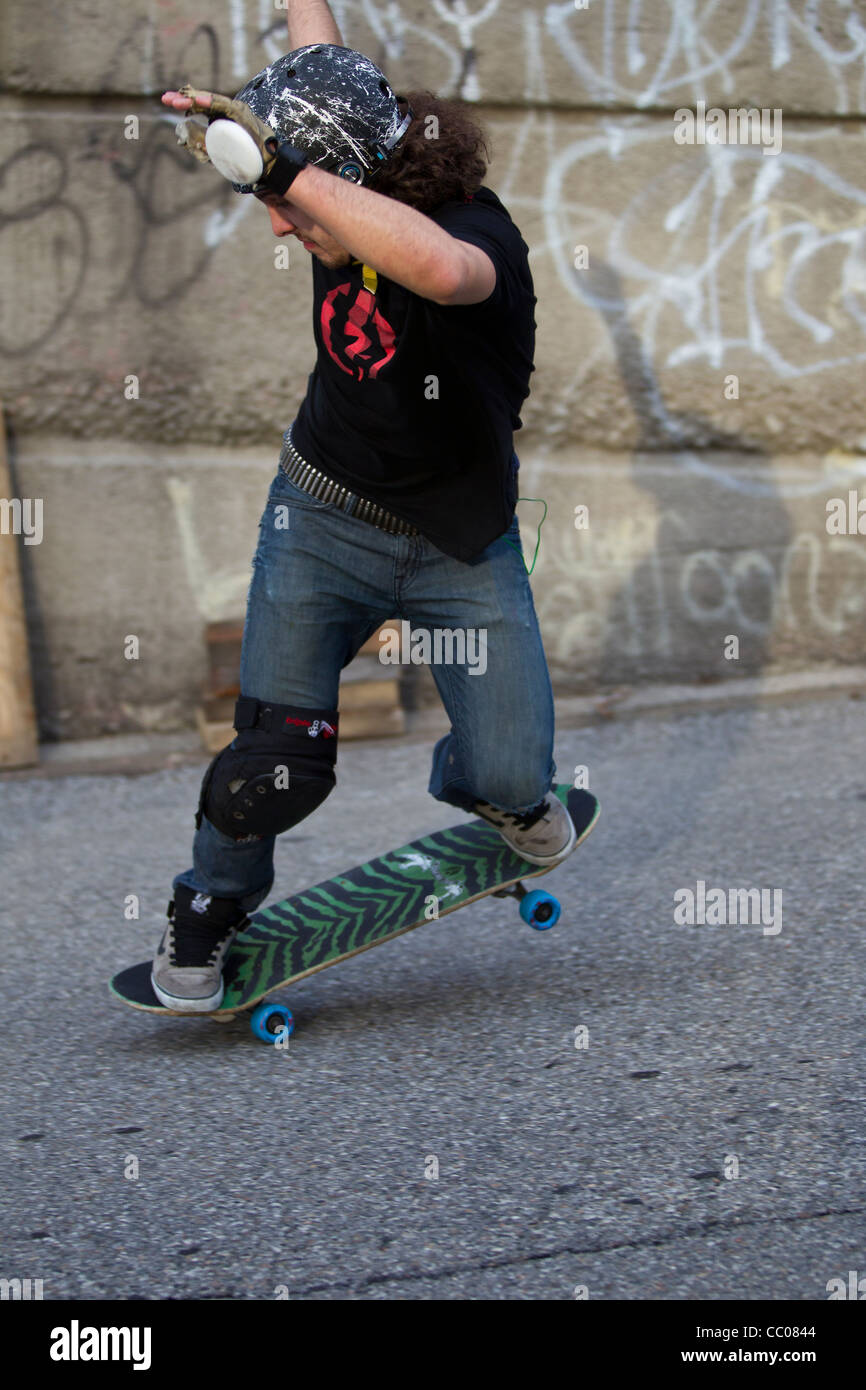 Young male skateboarder on urban street Stock Photo - Alamy