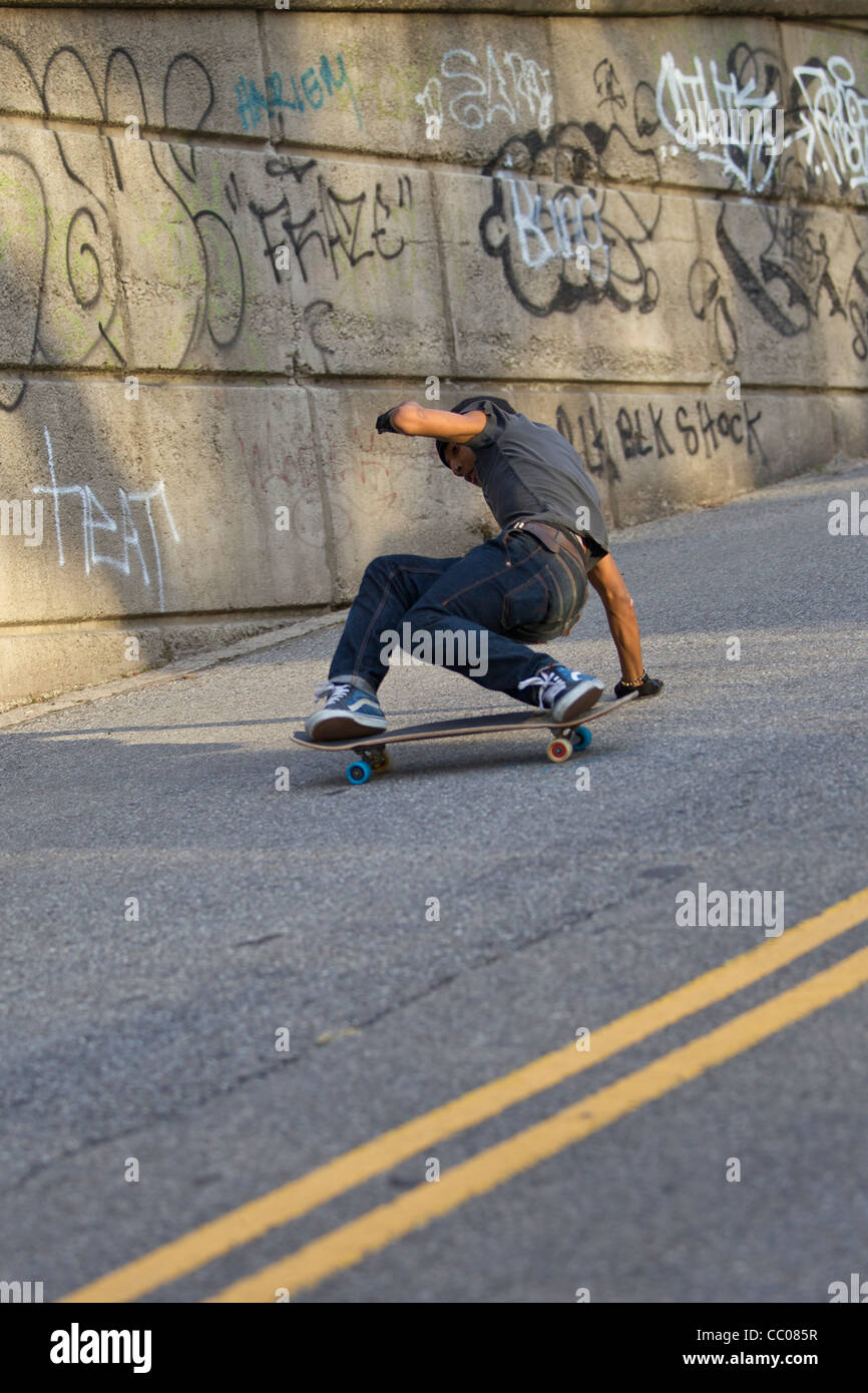 Young male skateboarder on urban street Stock Photo - Alamy
