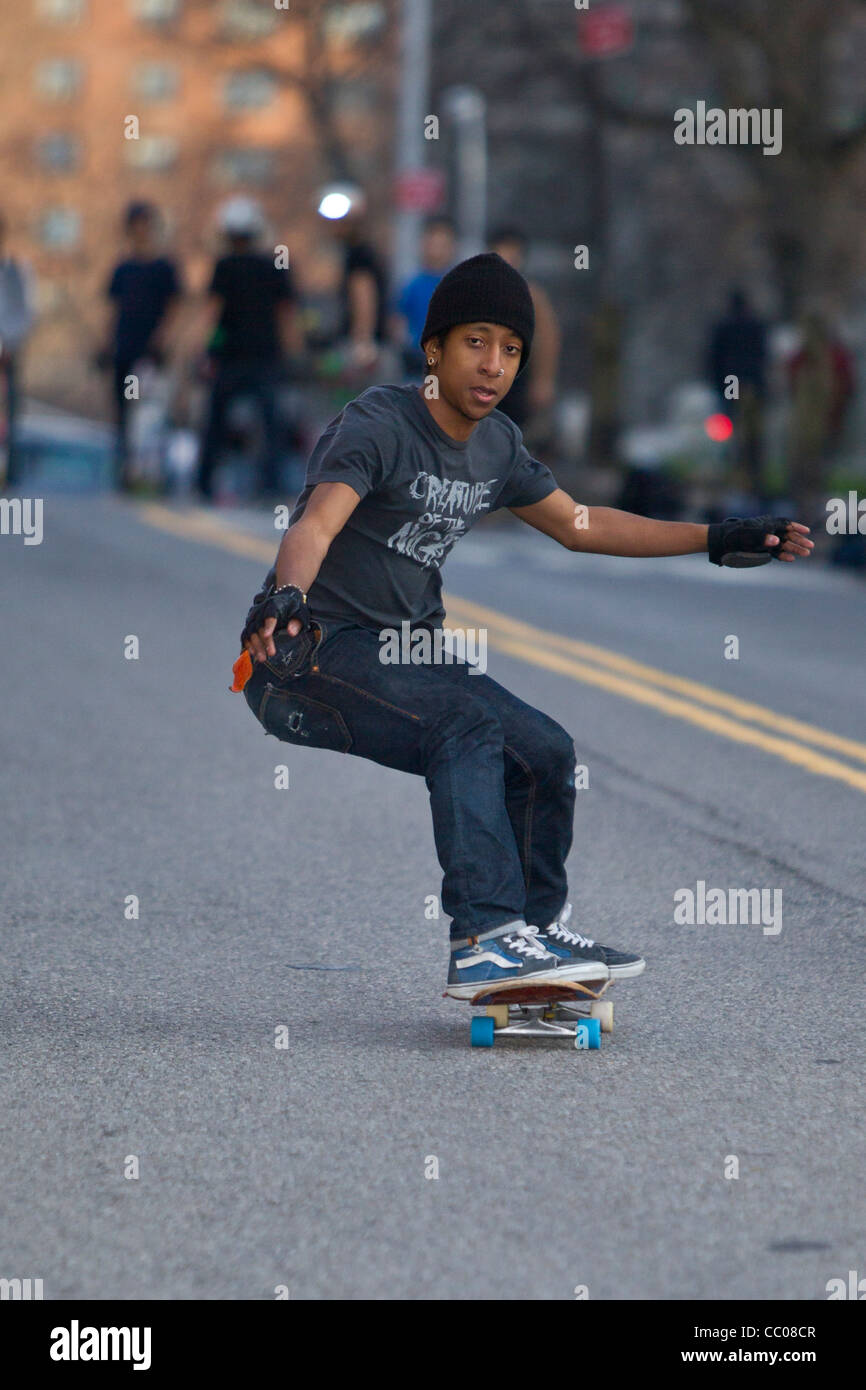 Young male skateboarder on urban street Stock Photo - Alamy