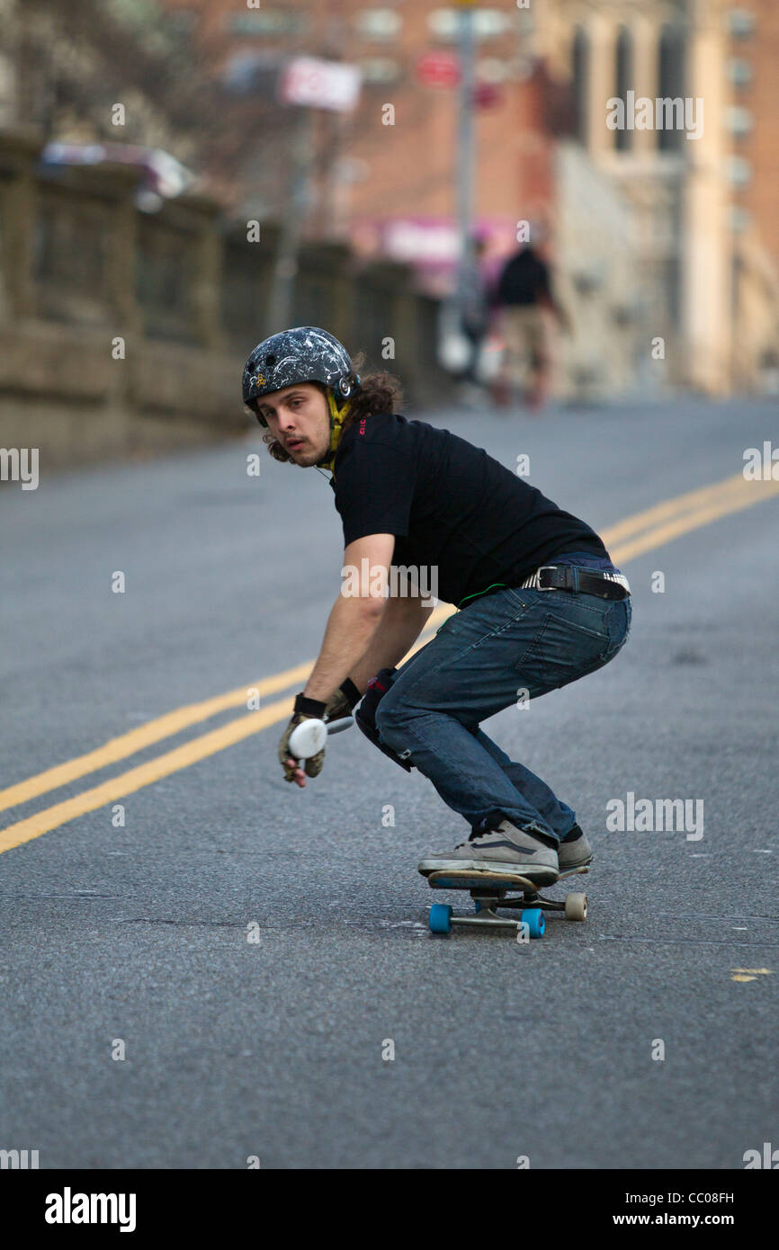 Young male skateboarder on urban street Stock Photo - Alamy