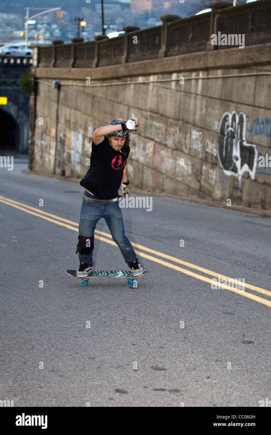 Young male skateboarder on urban street Stock Photo - Alamy
