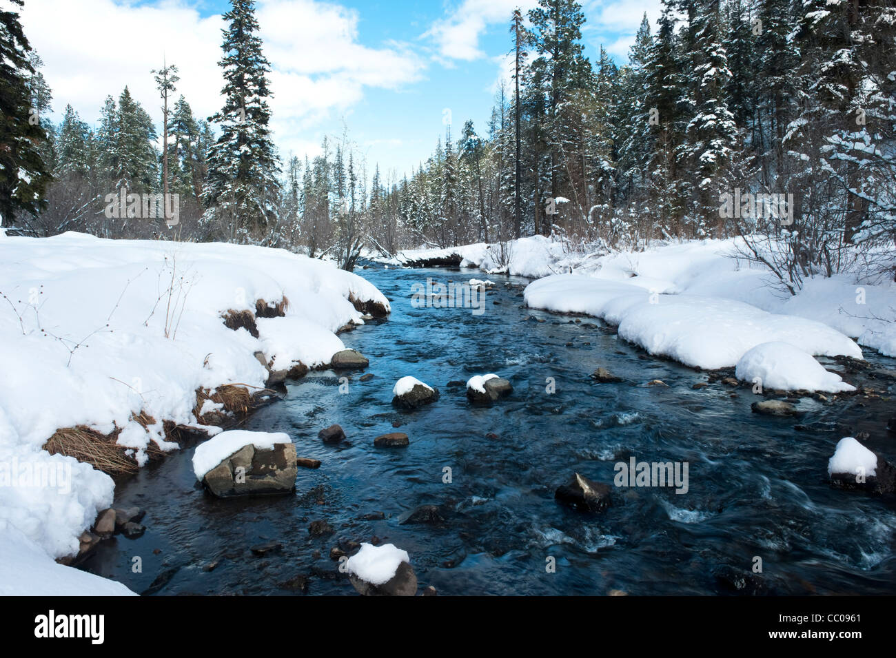 A river in the mountains with snow along the banks Stock Photo - Alamy