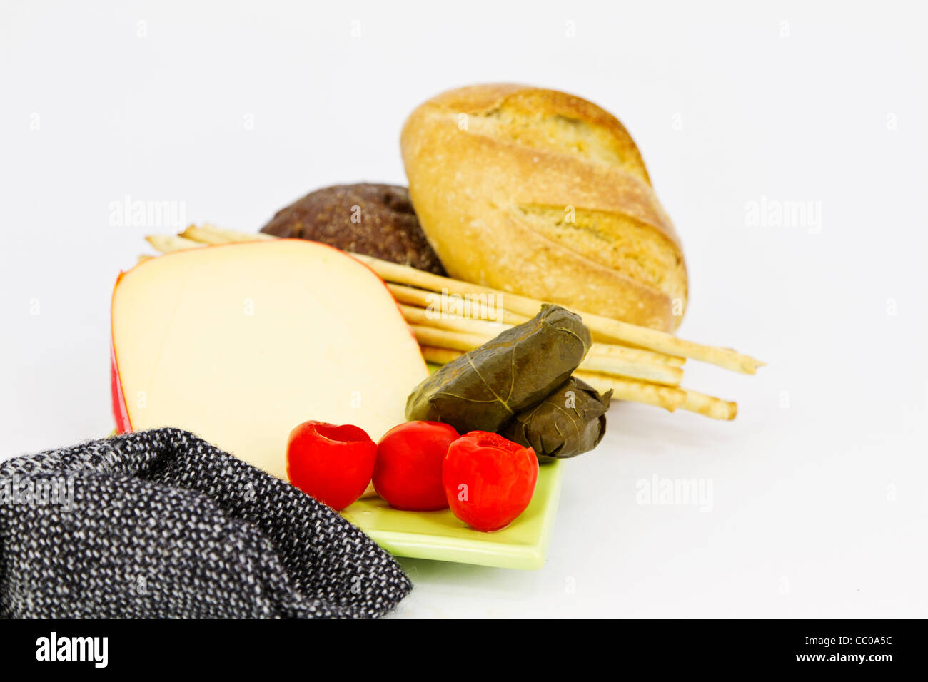 Country cheese with red rind placed with red peppadews, stuffed grape ...