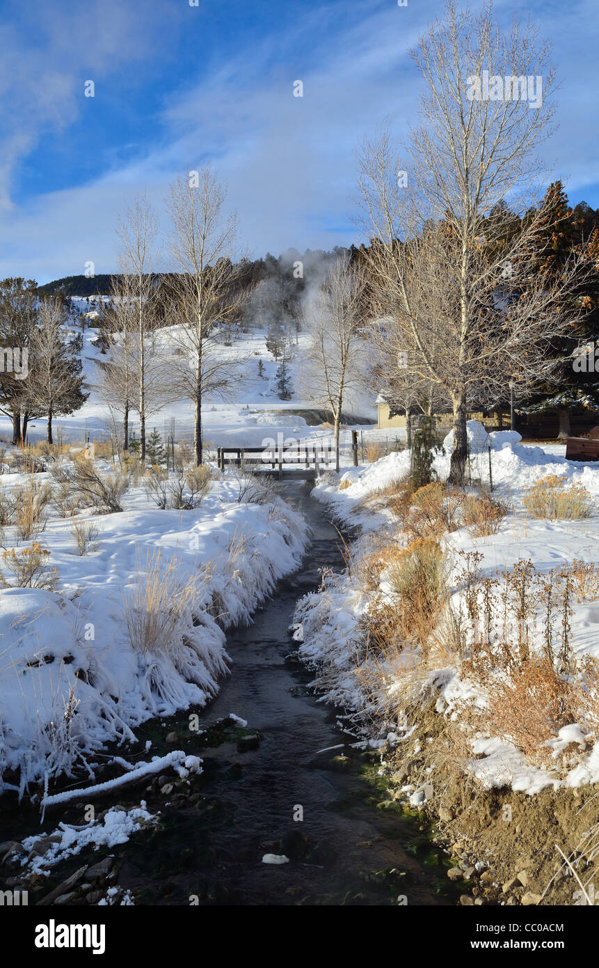 A small creek running through snow covered field. Mammoth Hot Springs ...