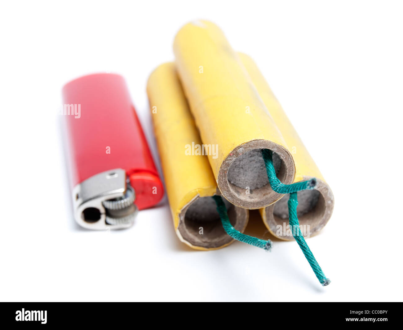Three firecrackers and lighter on a white background Stock Photo - Alamy