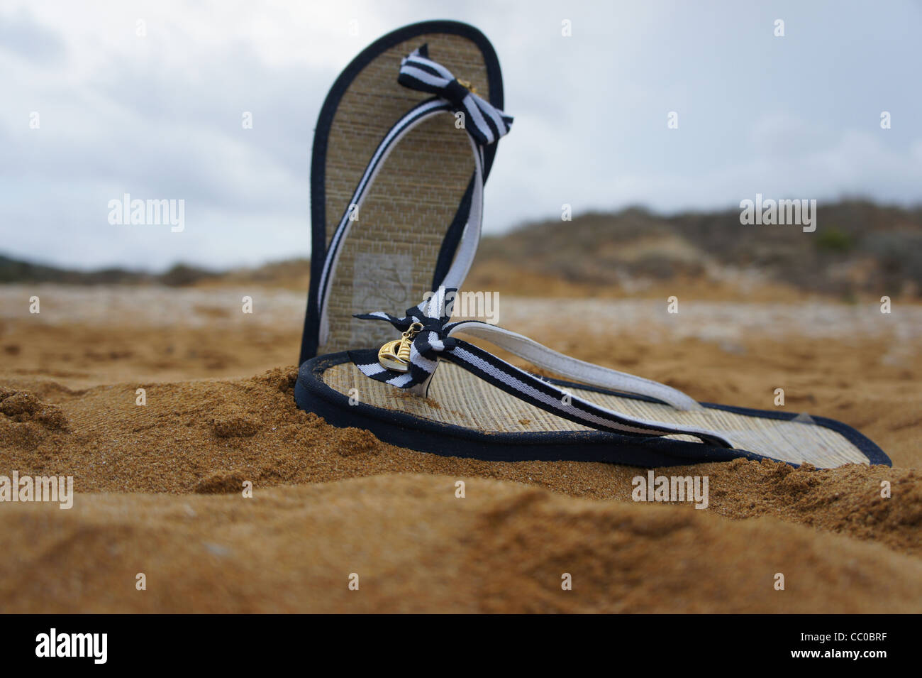 Flip flops on the beach Stock Photo - Alamy