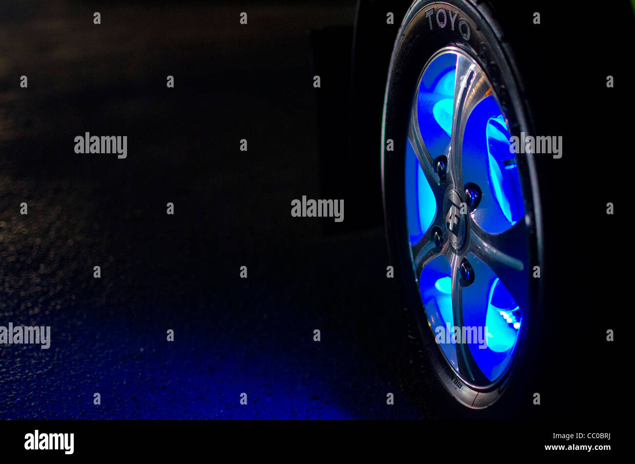 Blue light on the alloy wheel Stock Photo - Alamy