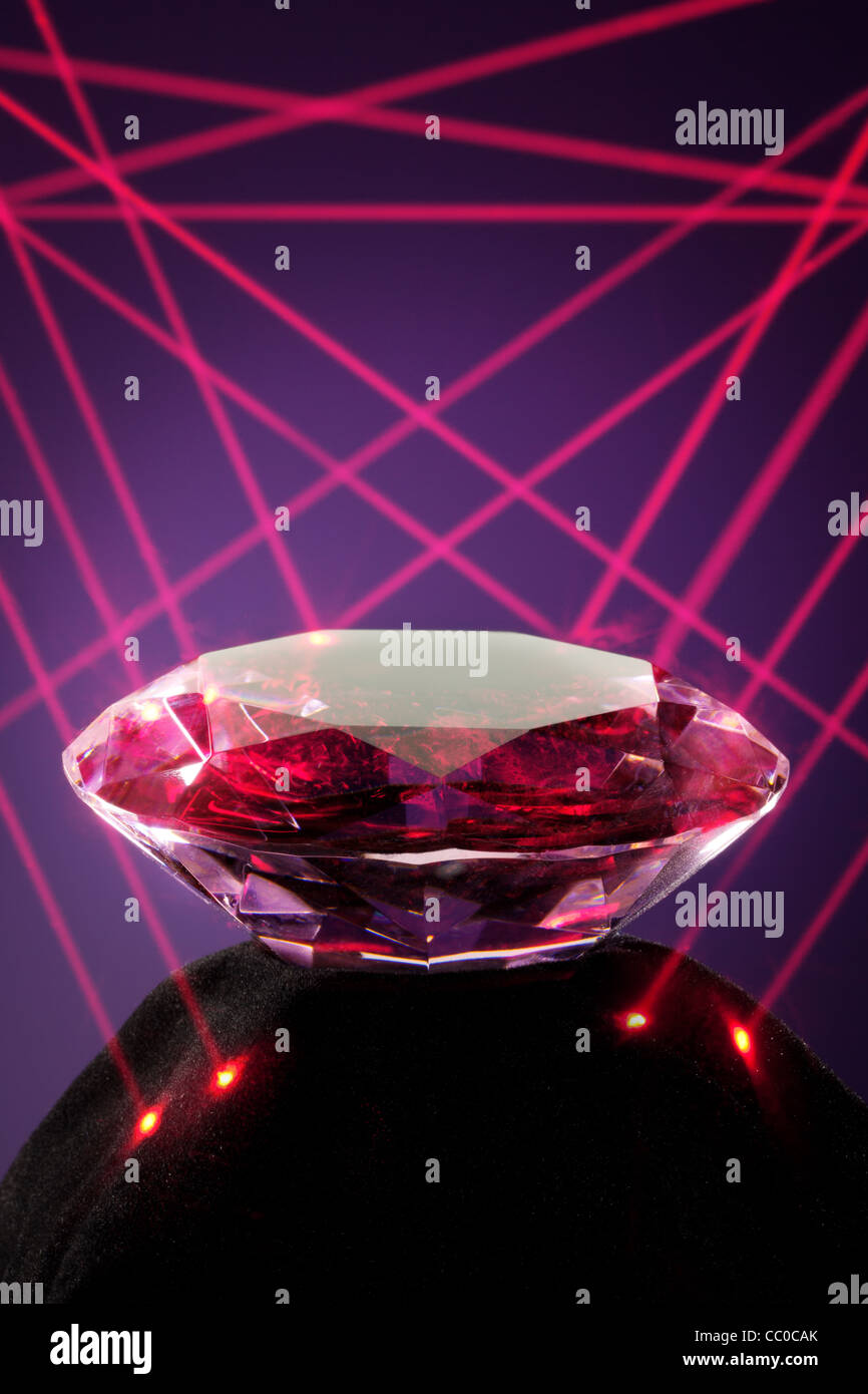 Security concept with crystal being guarded by laser alarm system Stock ...