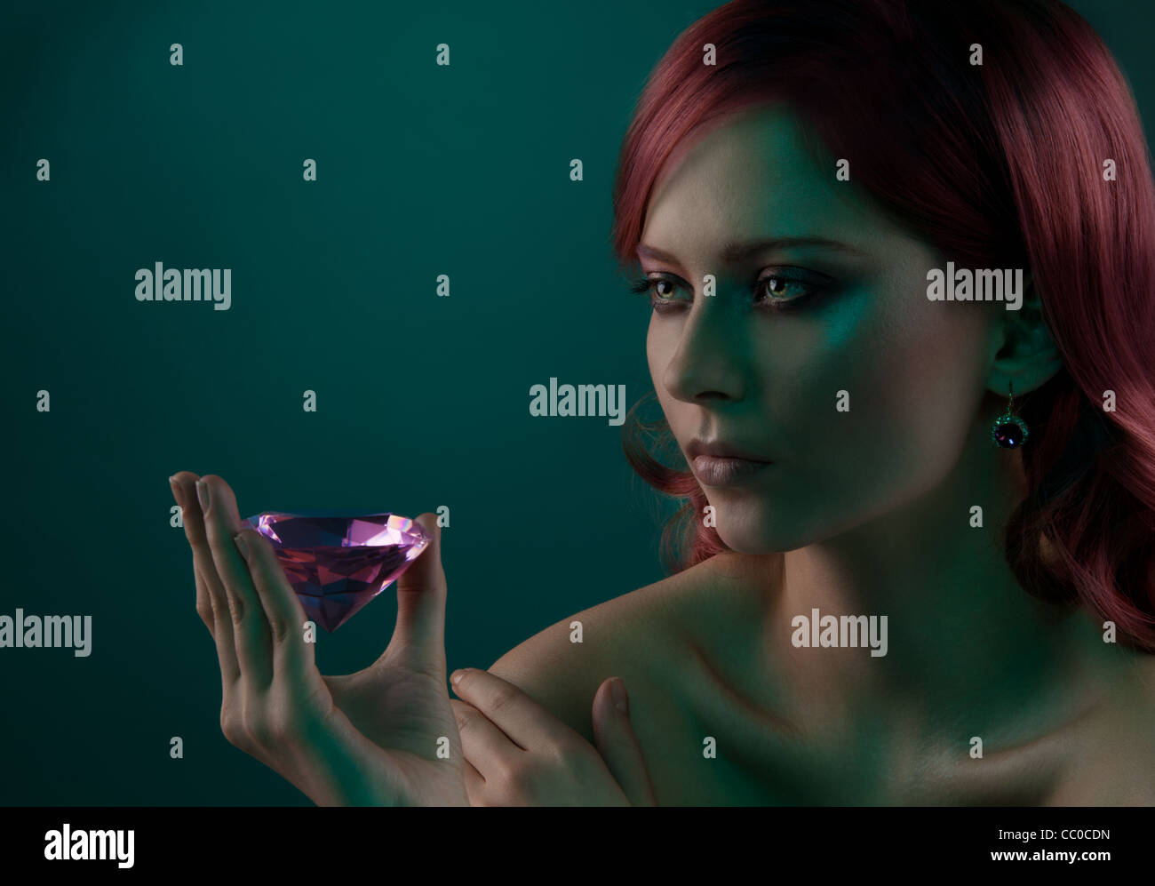 Beauty portrait of woman with big pink diamond Stock Photo - Alamy