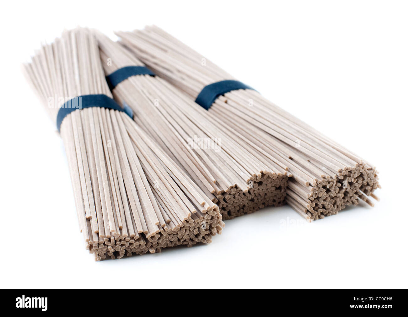 Bundles of buckwheat soba noodles. Isolated on white Stock Photo - Alamy
