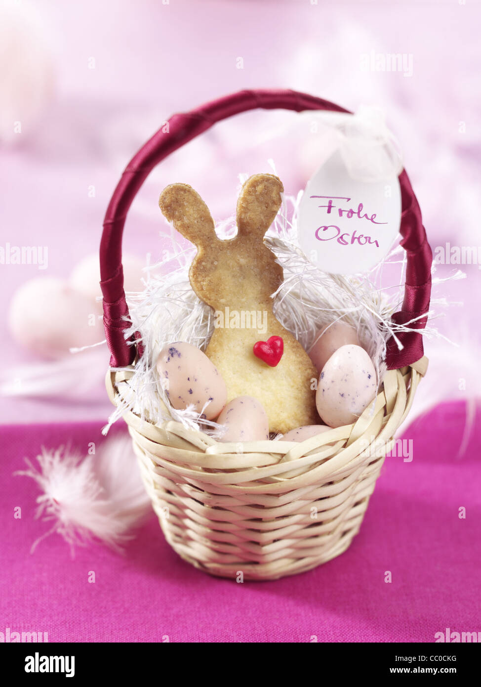 Single Easter bunny with heart in a little basket Stock Photo - Alamy