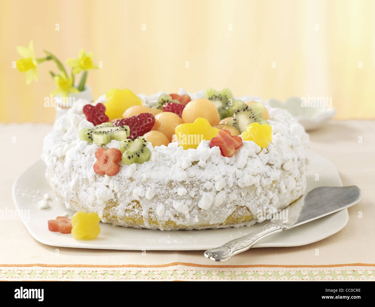 Lemon savarin cake with mixed fruits Stock Photo - Alamy