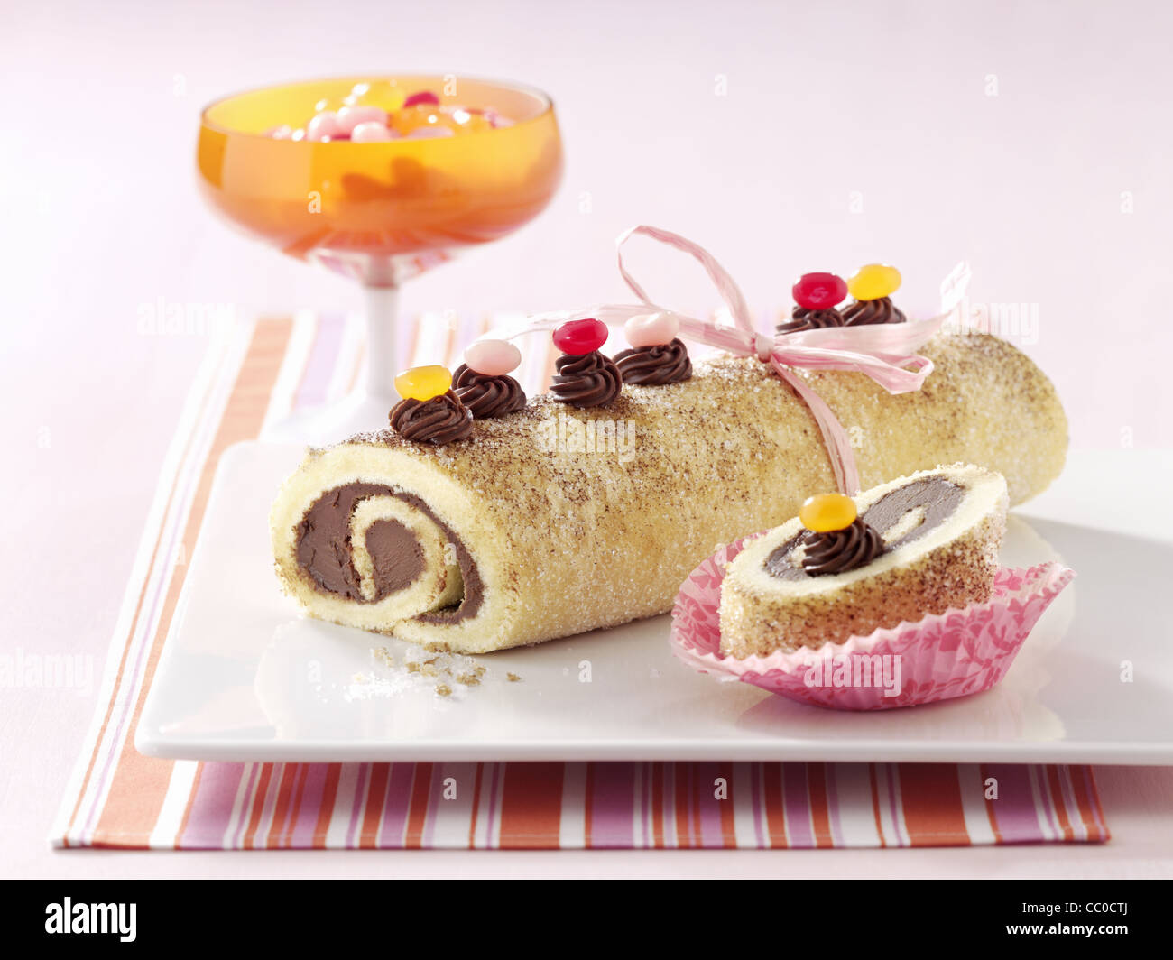 Sponge roll with chocolate cream stuffing Stock Photo - Alamy