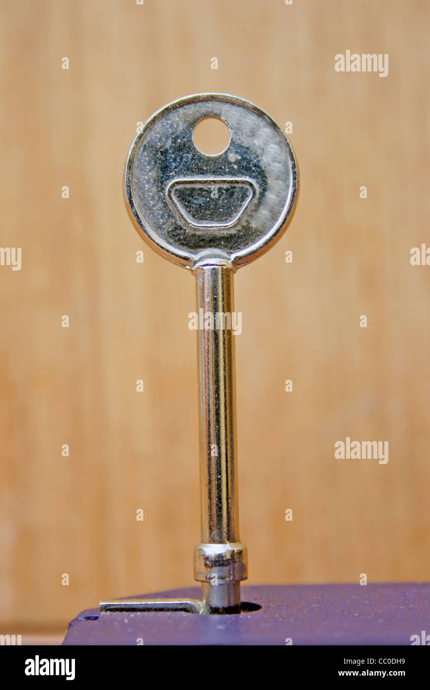 A key in a lock Stock Photo - Alamy