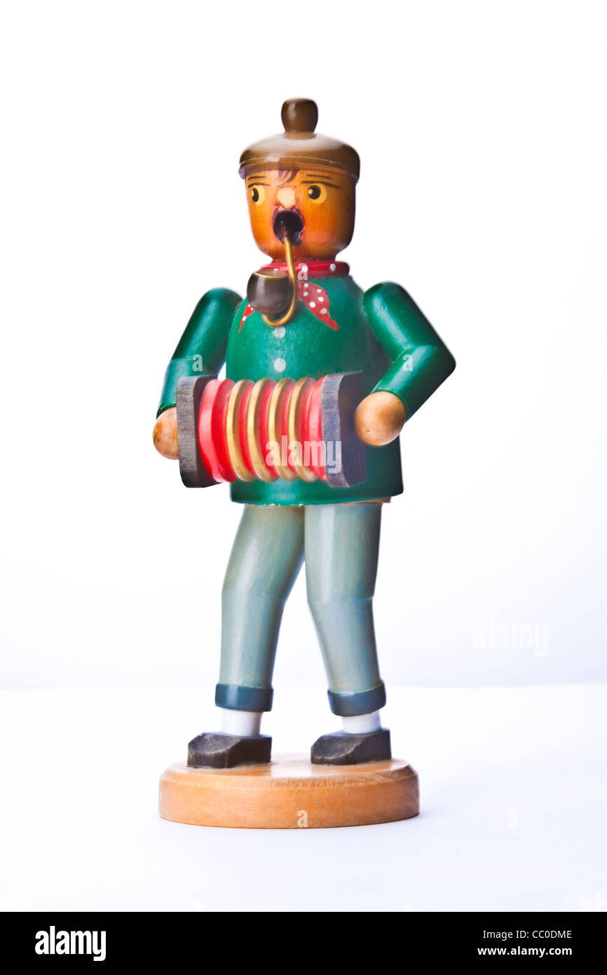 A carved, wooden smoking figure Stock Photo - Alamy