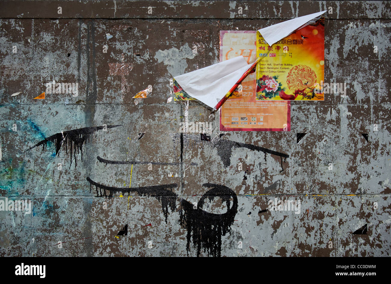Torn posters on a dirty wall, Chinatown, London Stock Photo - Alamy
