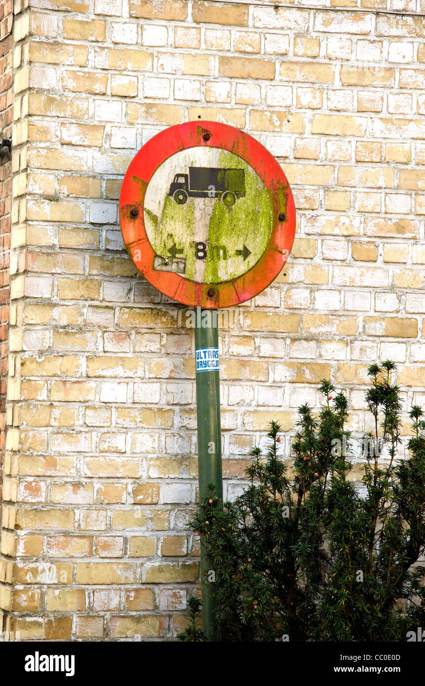 grunge road sign in the city street near wall Stock Photo - Alamy