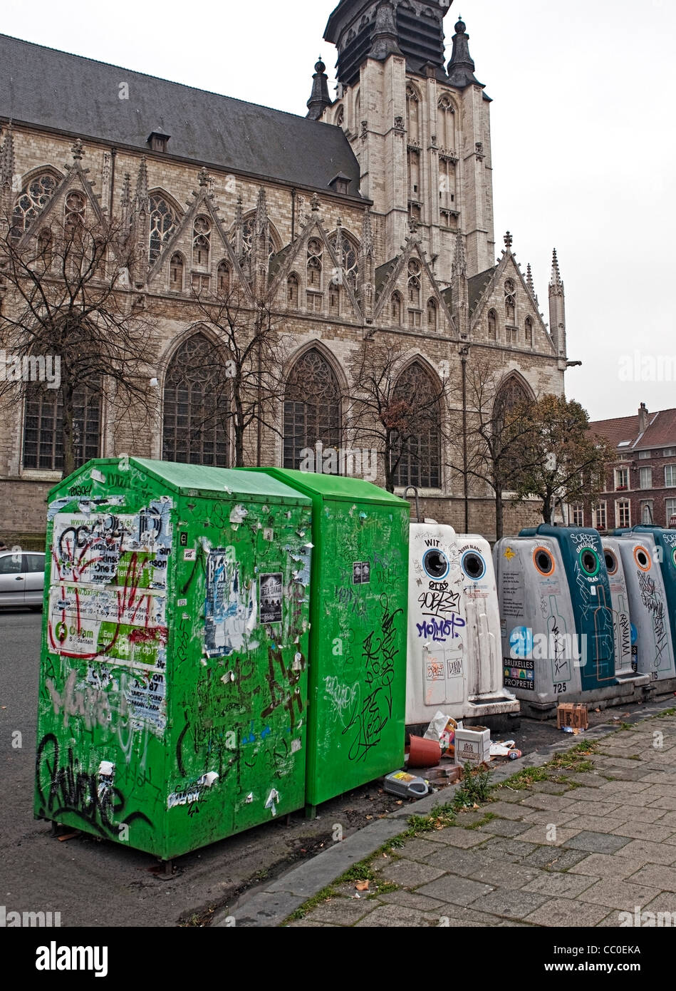 Overflowing rubbish containers close to a church Stock Photo - Alamy